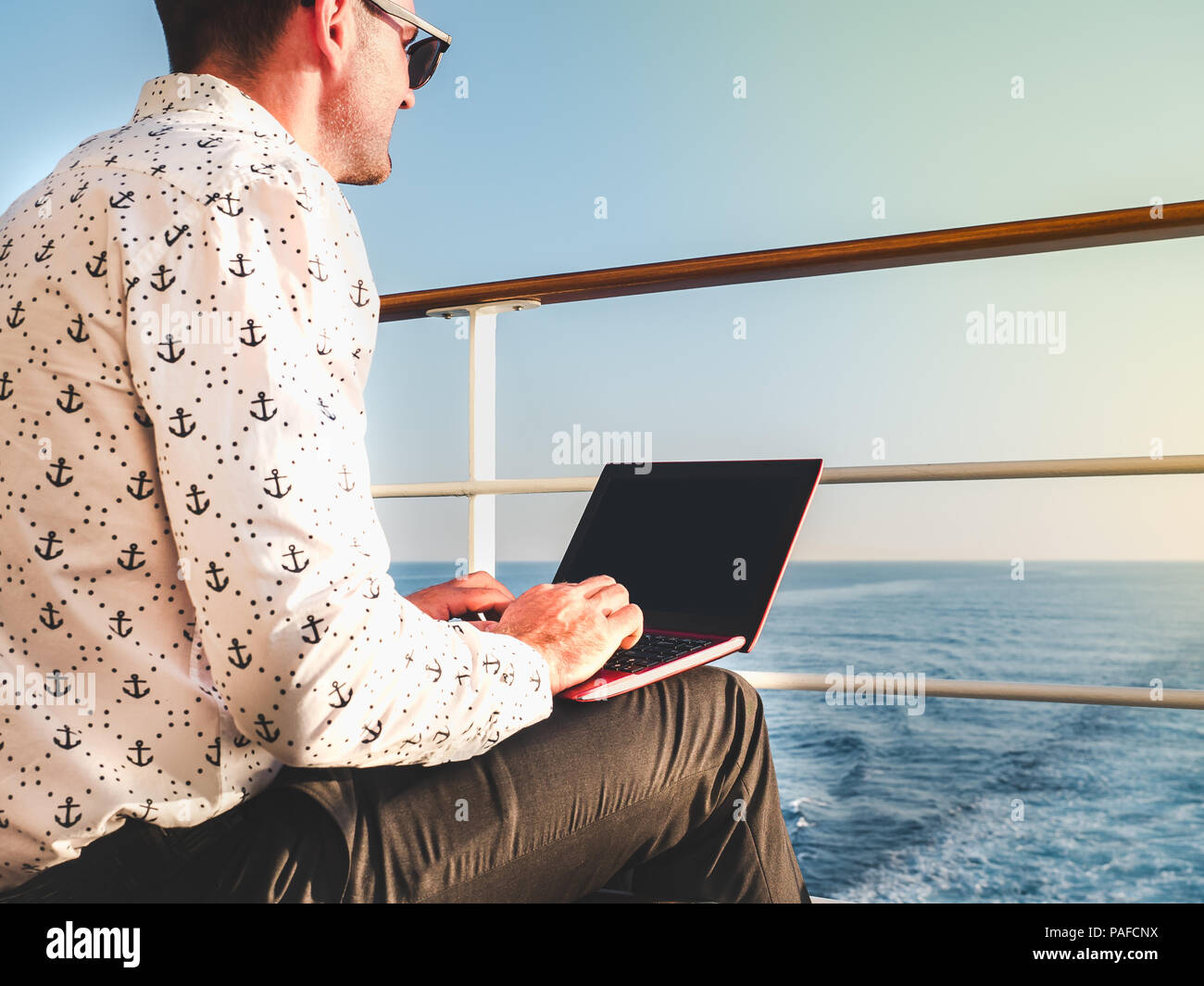 Stylish, attractive man with laptop Stock Photo - Alamy
