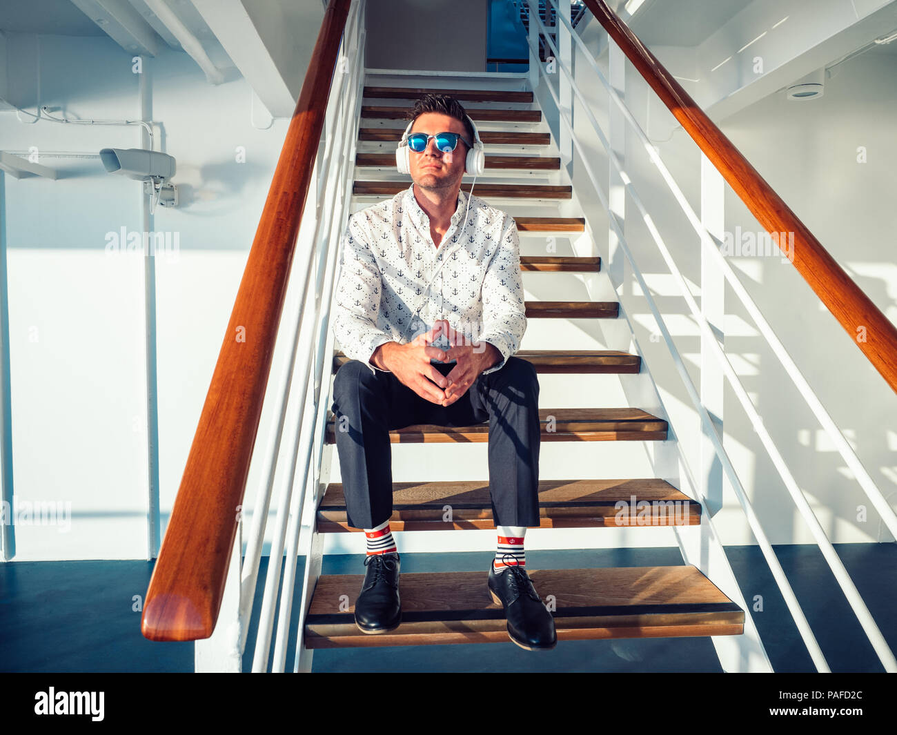Stylish, young man on the deck Stock Photo - Alamy