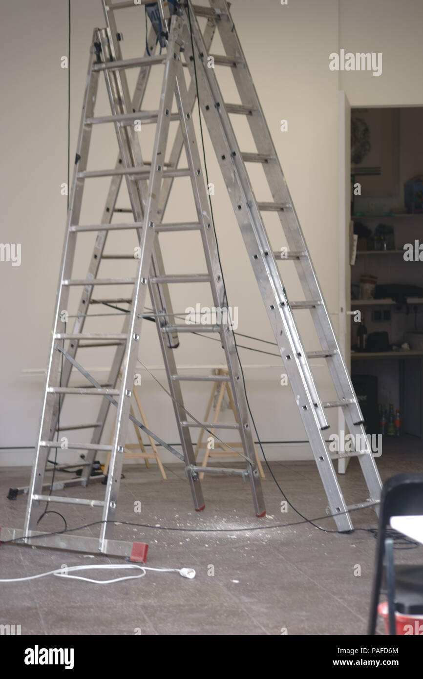 Fold-up ladders in a newly renovated interior of a shop or office space ...
