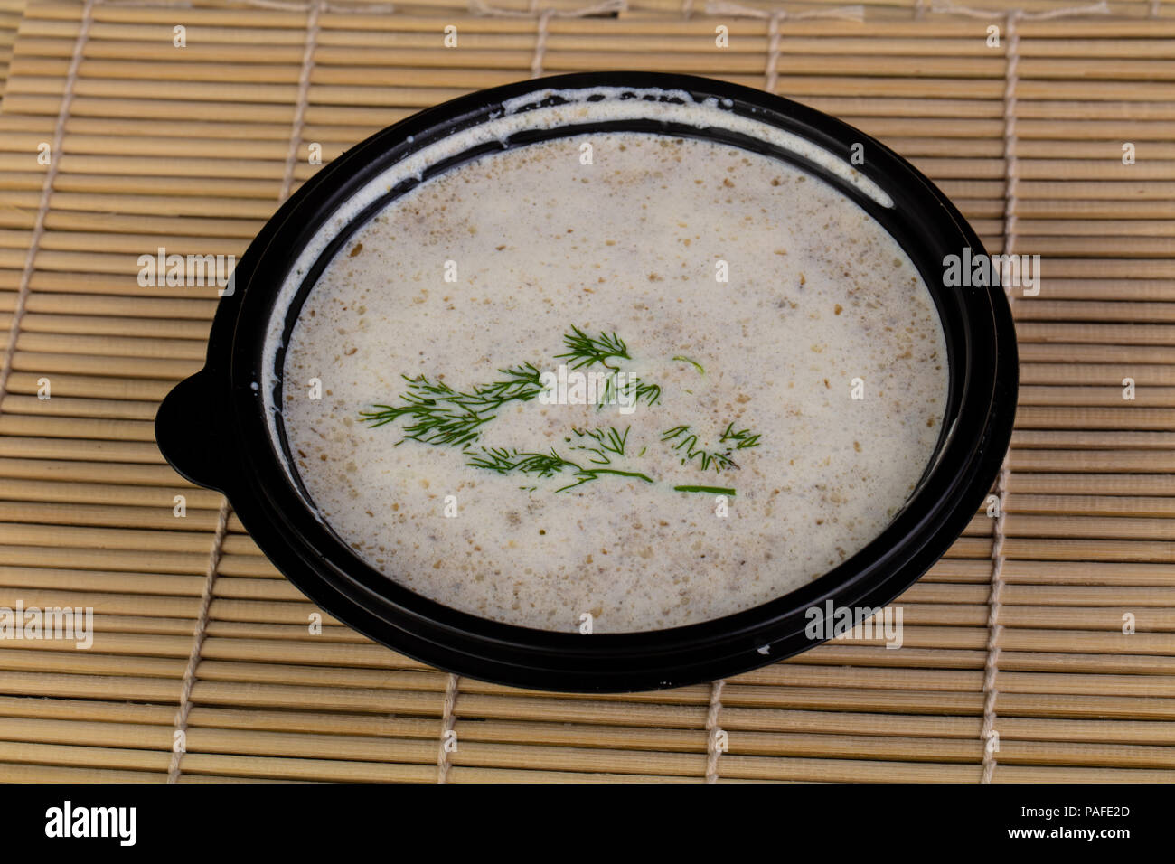 Appetizing cream soup with champignons Stock Photo - Alamy