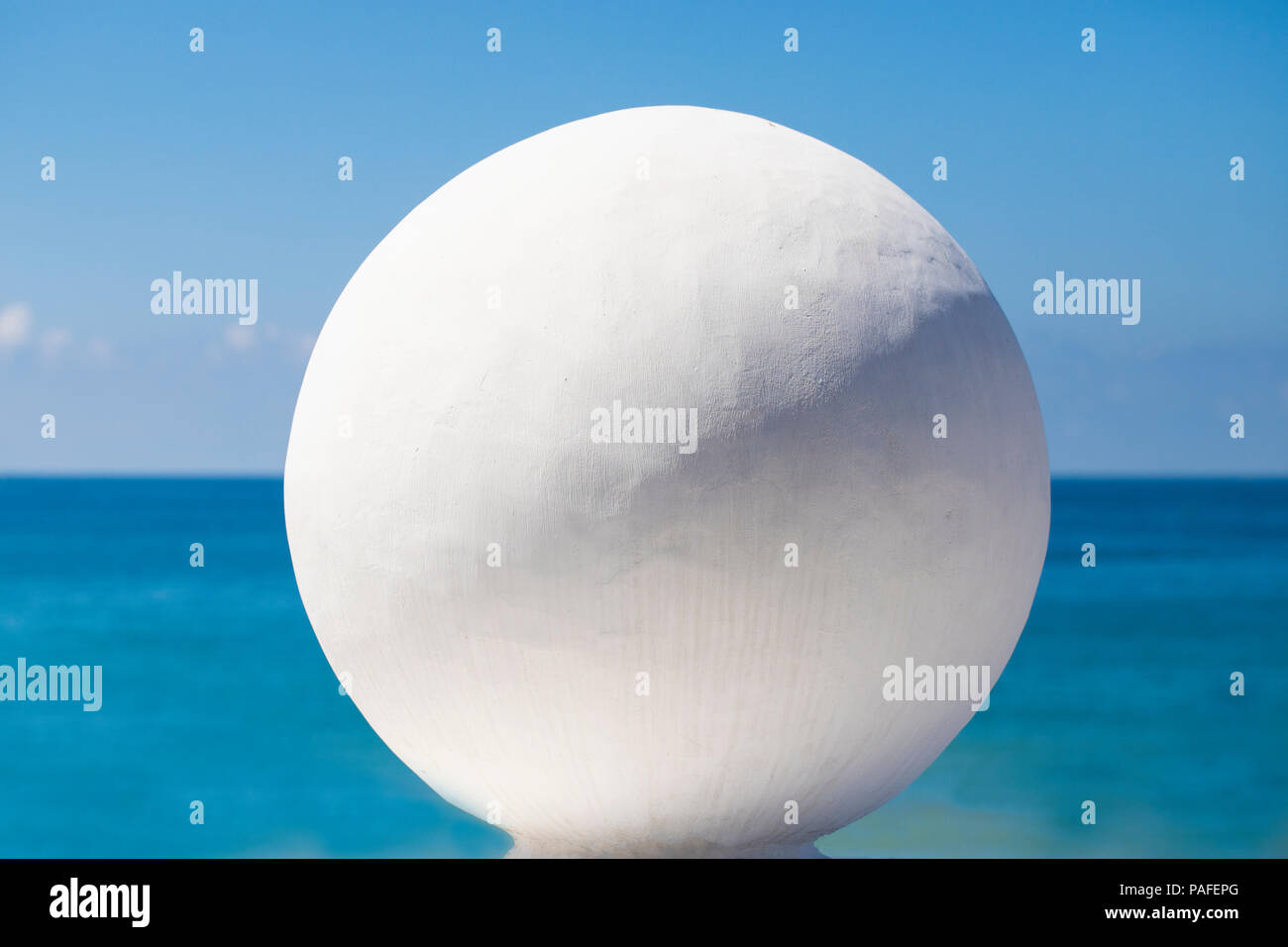 Stone ball on the background of the sea Stock Photo - Alamy