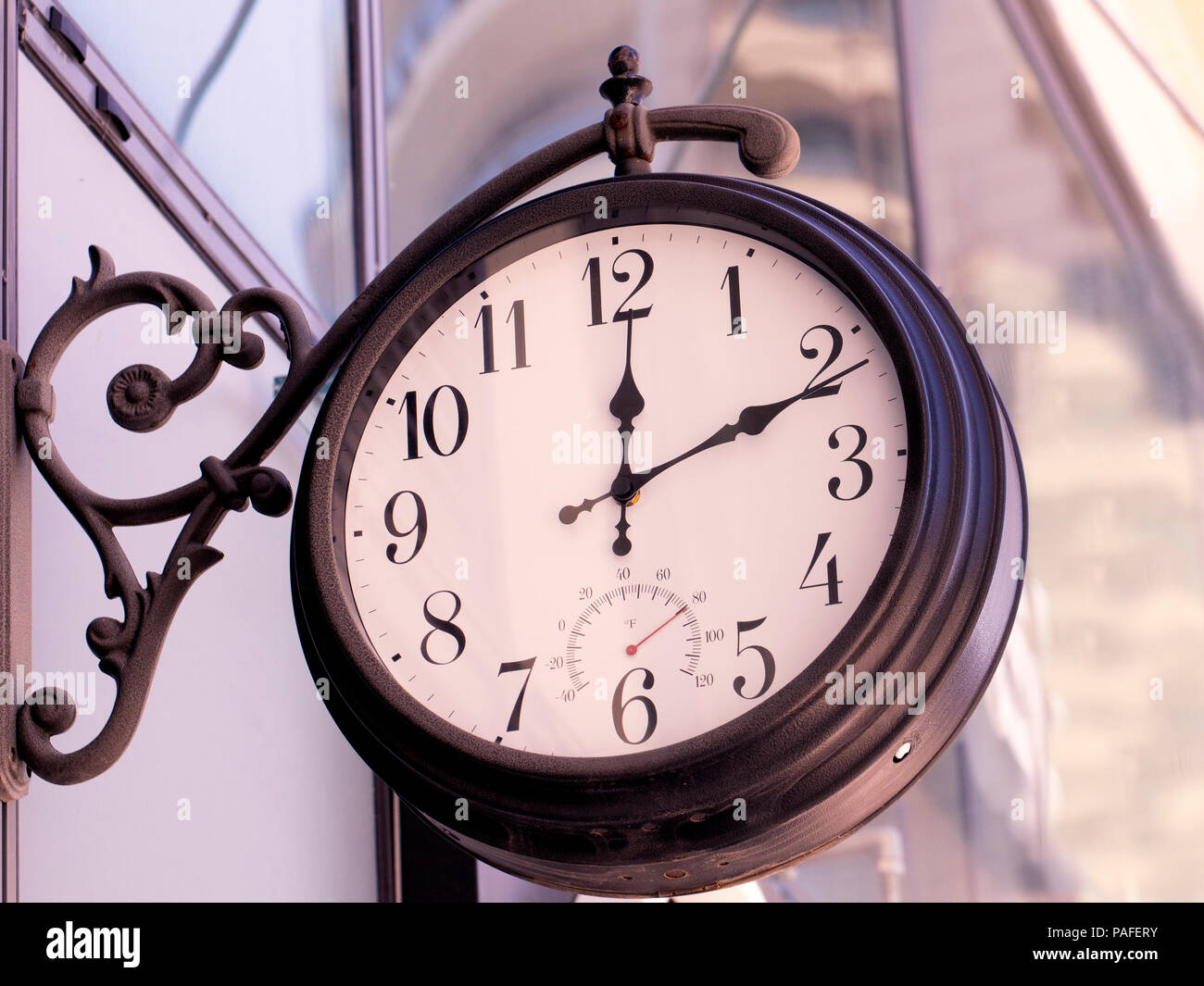 Street clock on the wall Stock Photo - Alamy