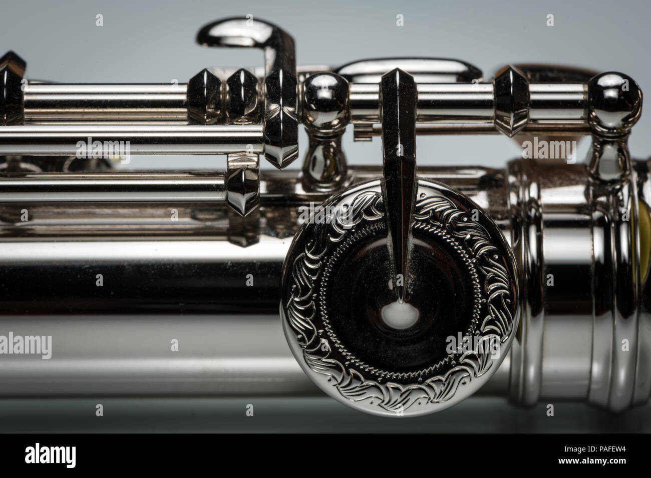 Closeup of engraved keys of a platinum plated silver flute Stock Photo ...
