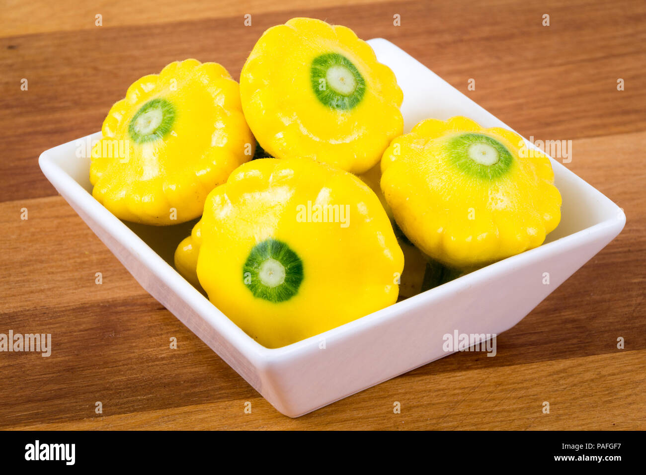 small size patty pan patisson squash closeup wood background Stock ...
