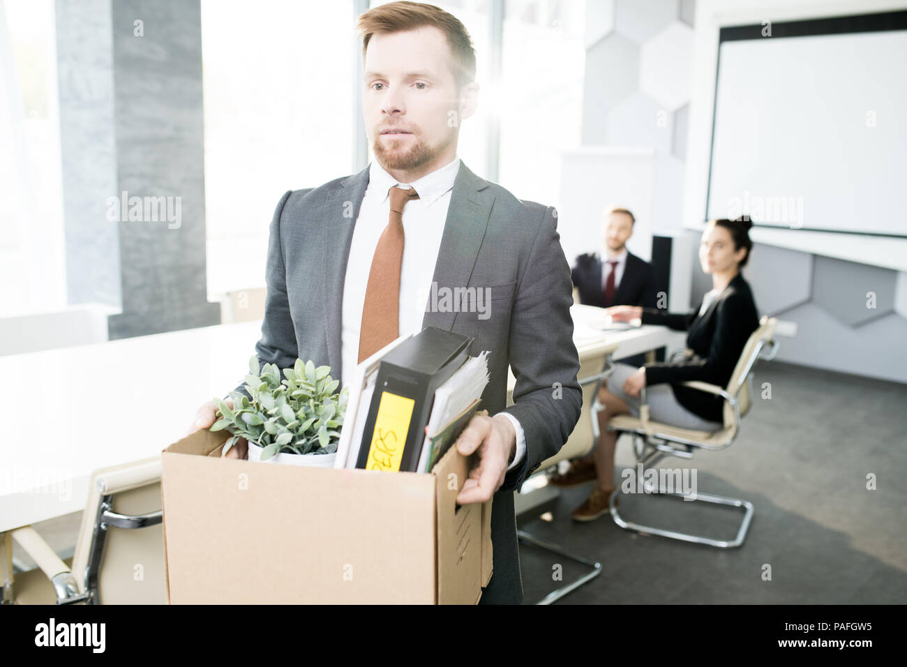 Young Businessman Leaving Job Stock Photo - Alamy