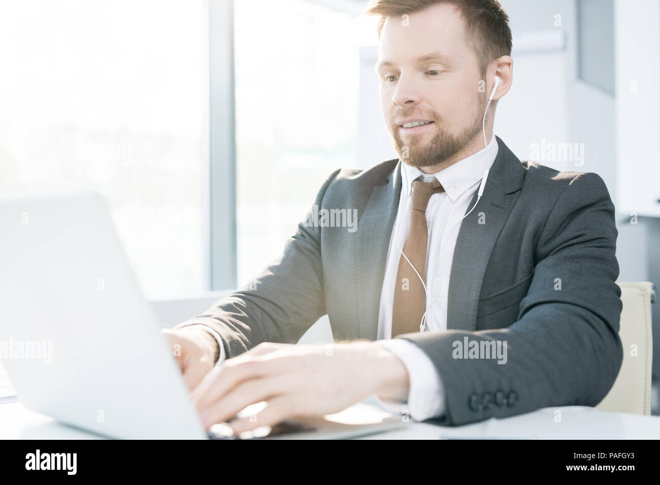 Modern Young Businessman Using Laptop Stock Photo - Alamy