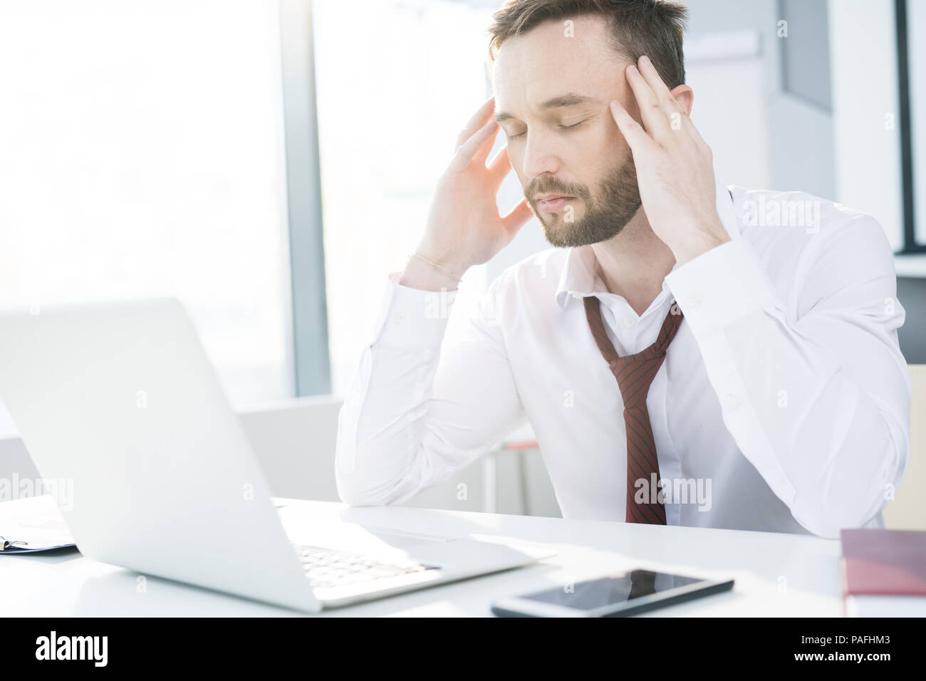 Exhausted Businessman Working Stock Photo - Alamy
