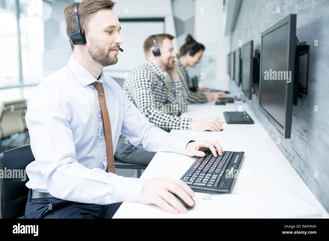 Handsome call center operator hi-res stock photography and images - Alamy