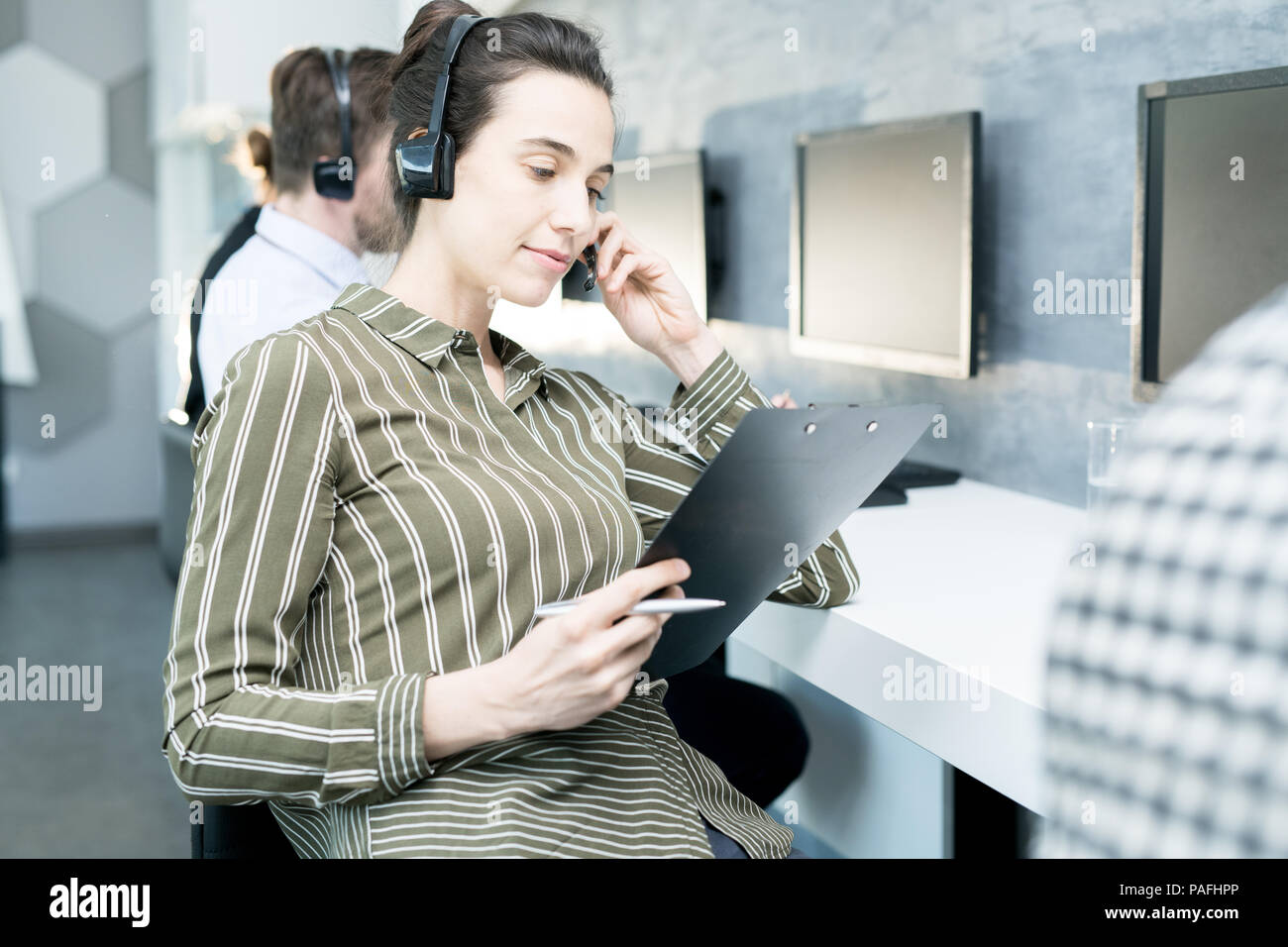 Young Woman in Help Desk Stock Photo - Alamy