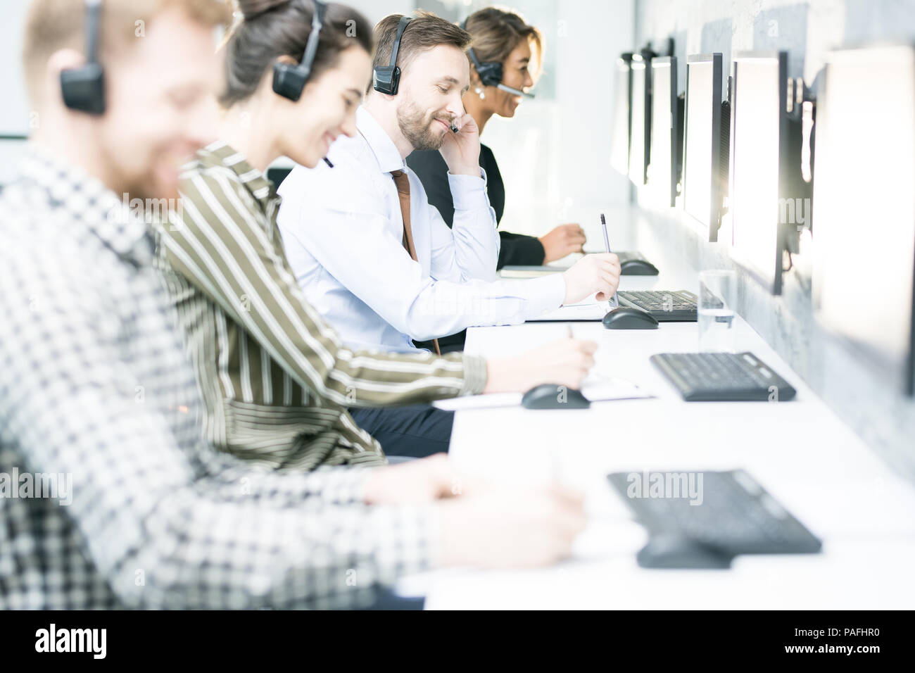 Customer Support Operators in Row Stock Photo - Alamy