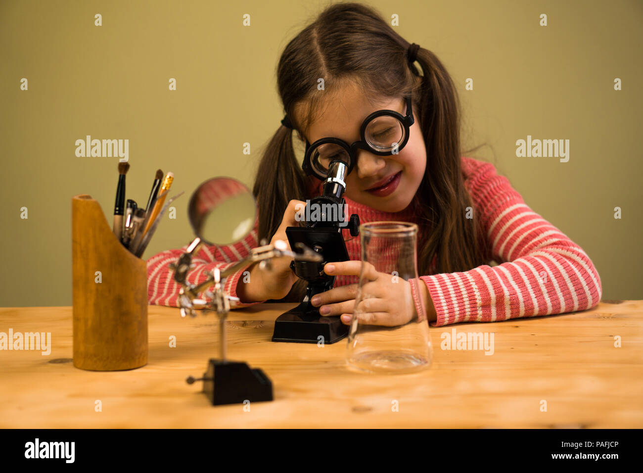 Little Girl Looking in Microscope. Child Education Stock Photo - Alamy
