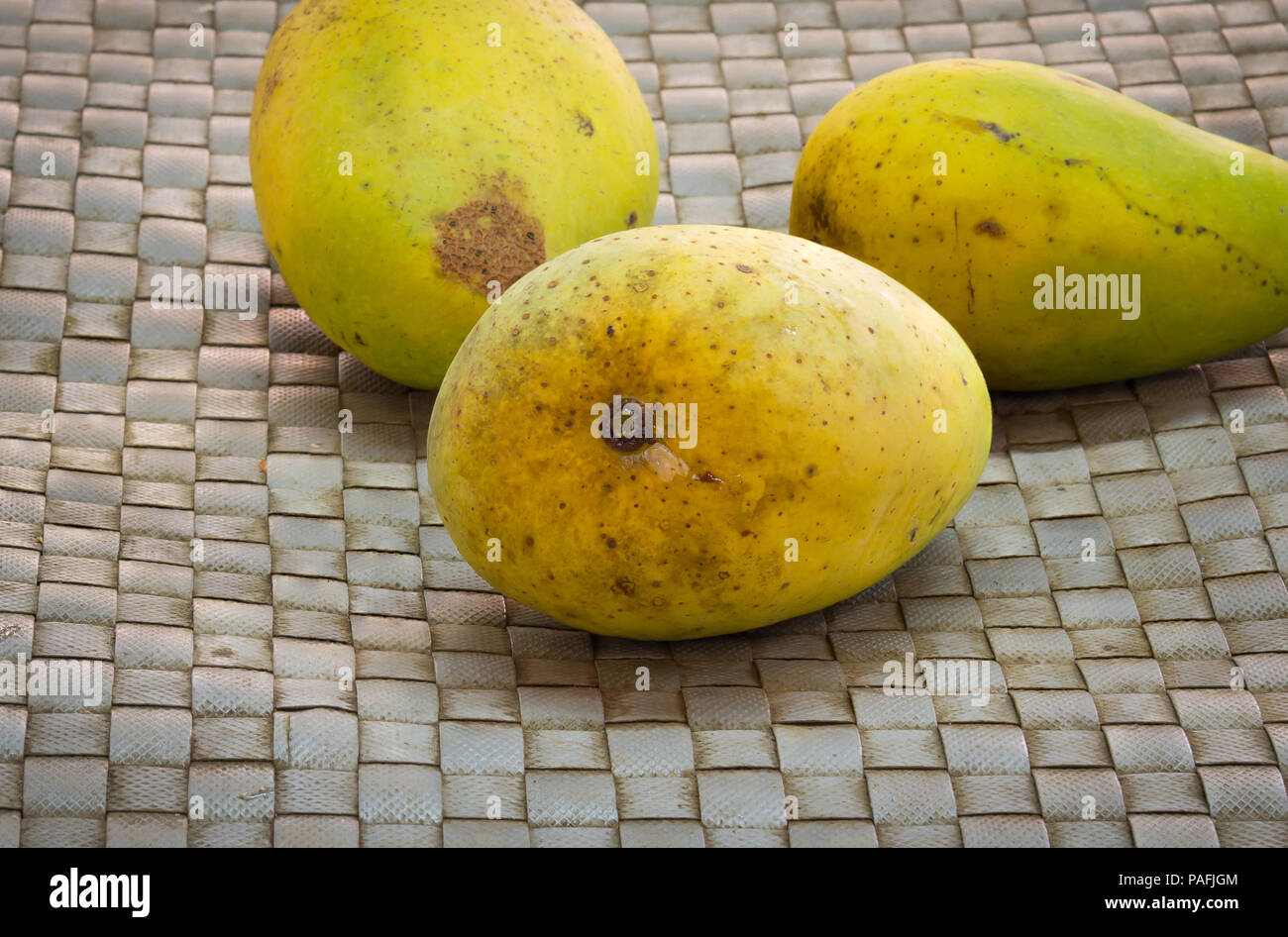 Fresh yellow mango in the Basket on white background Stock Photo - Alamy