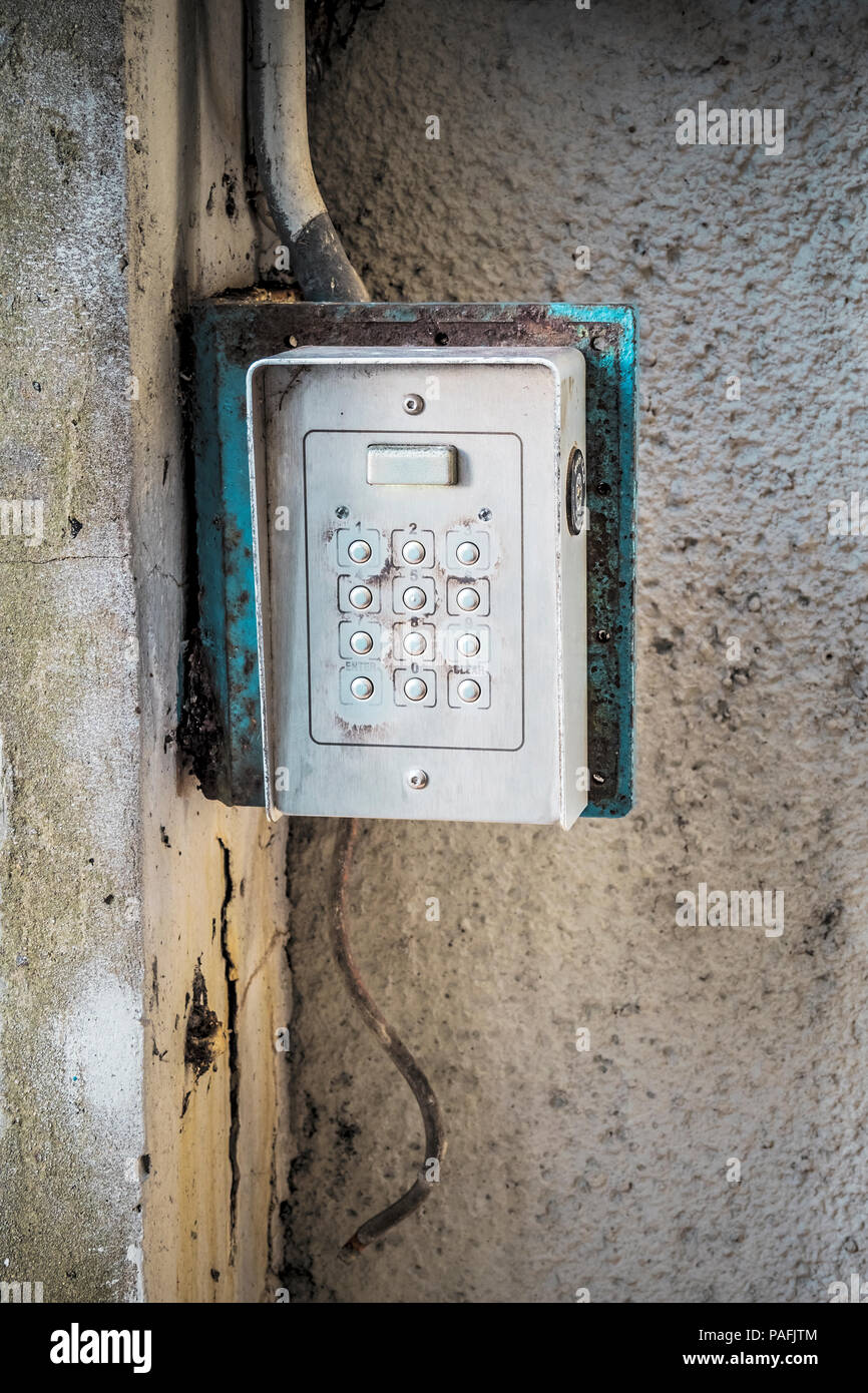 And old broken entry keypad next to an outdoor gate Stock Photo - Alamy