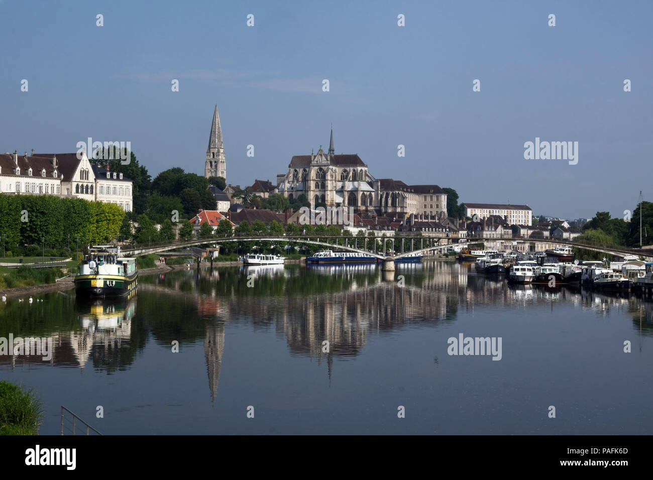 Abbey of Saint Germain, Auxerre with canal boats on the river Yonne ...