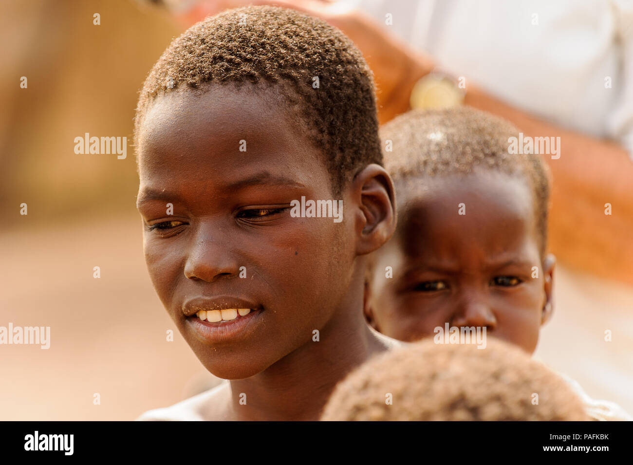ACCRA, GHANA - MARCH 6, 2012: Unidentified Ghanaian boy carries his ...