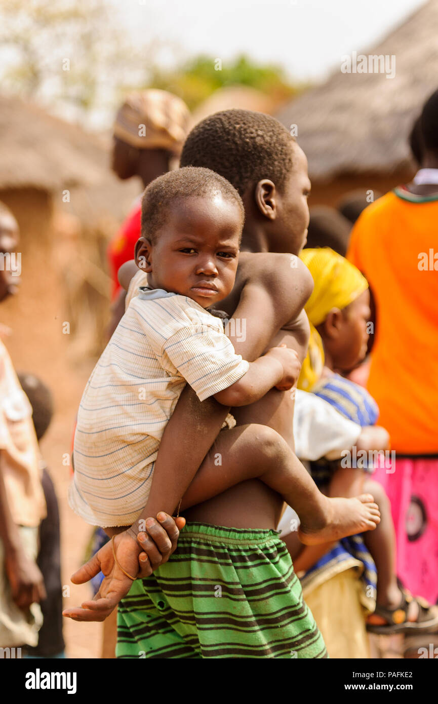 ACCRA, GHANA - MARCH 6, 2012: Unidentified Ghanaian boy carries his ...