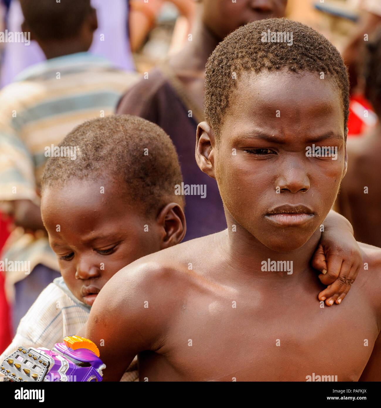 ACCRA, GHANA - MARCH 6, 2012: Unidentified Ghanaian boy carries his ...