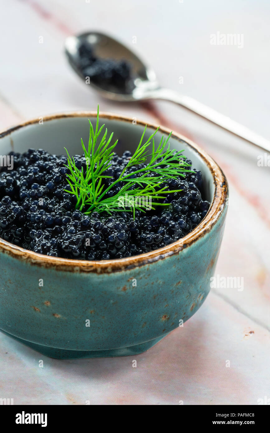 Black lumpfish caviar in a small pot Stock Photo - Alamy