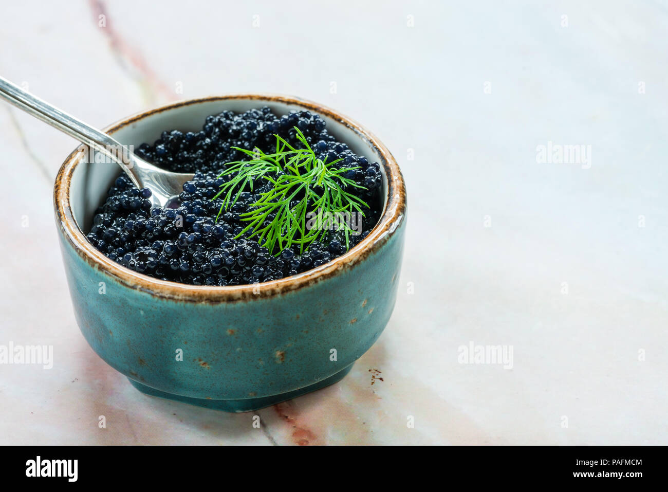 Black lumpfish caviar in a small pot Stock Photo - Alamy