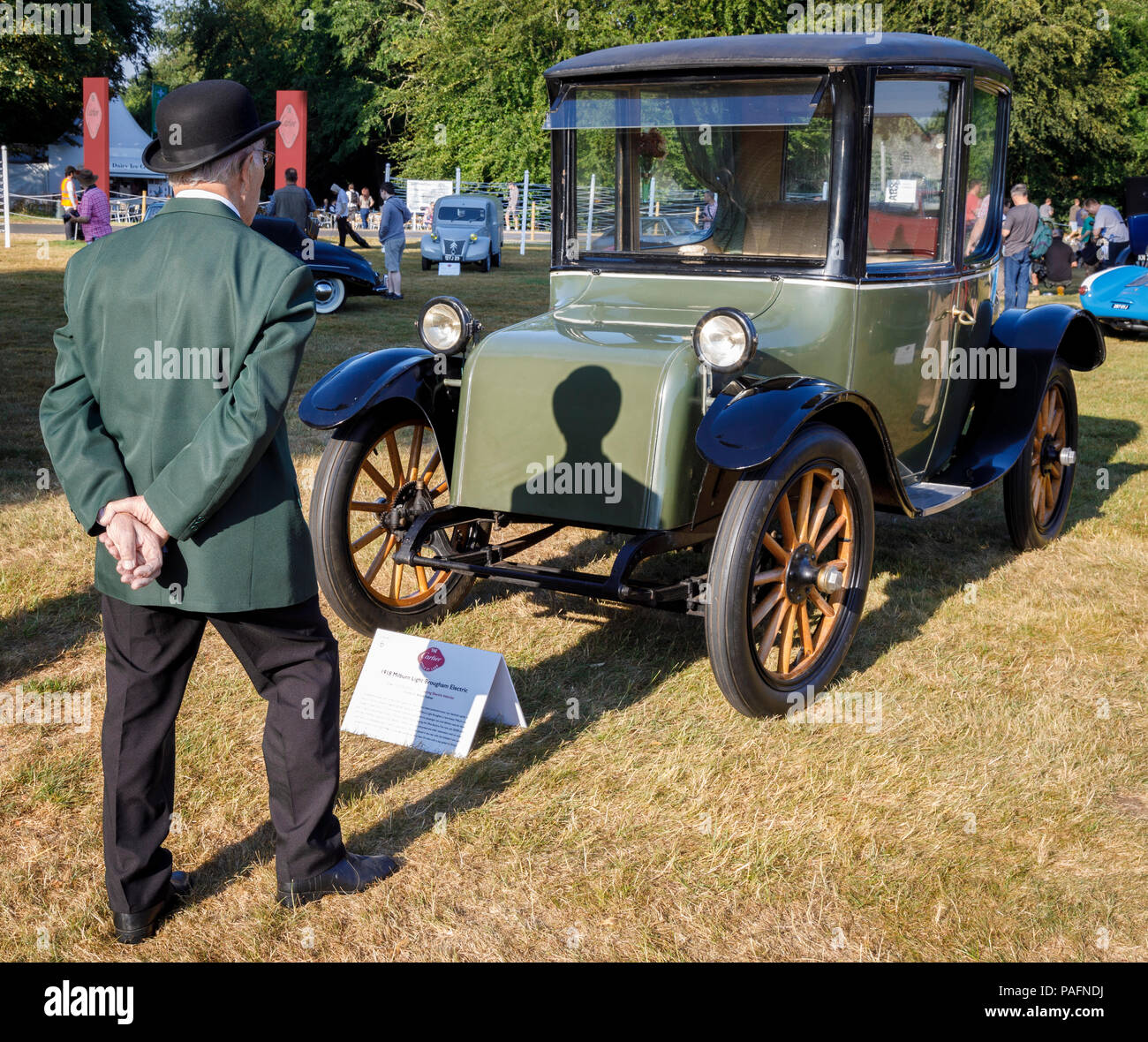 1918 Milburn Light Brougham Electric with gent viewing in similarly ...