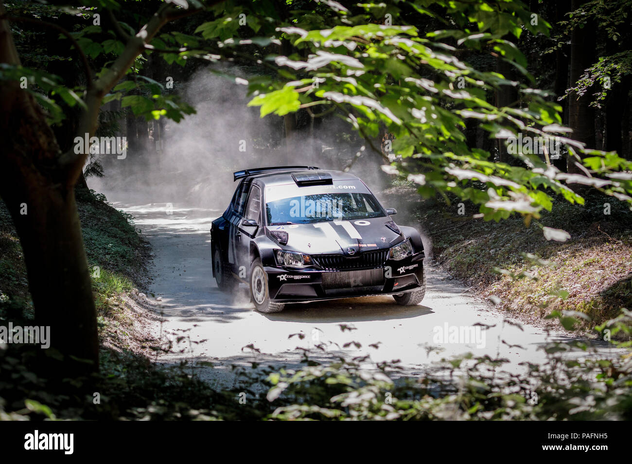 2018 Skoda Fabia R5 rally car with driver Chris Ingram on the dusty ...