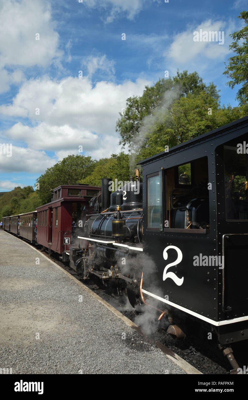 A vintage steam locomotive pulling a train on the Brecon Mountain ...