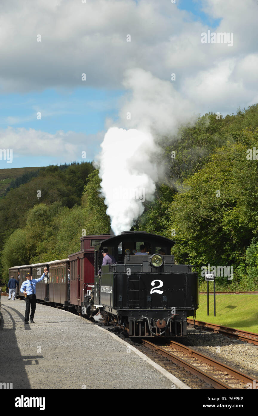 A vintage steam locomotive pulling a train on the Brecon Mountain Railway in south Wales Stock ...