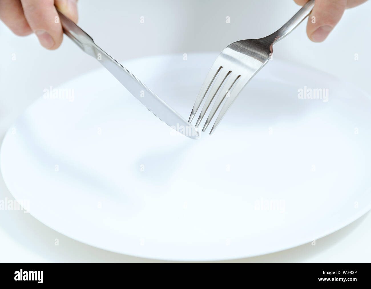 Hold a knife and fork hi-res stock photography and images - Alamy