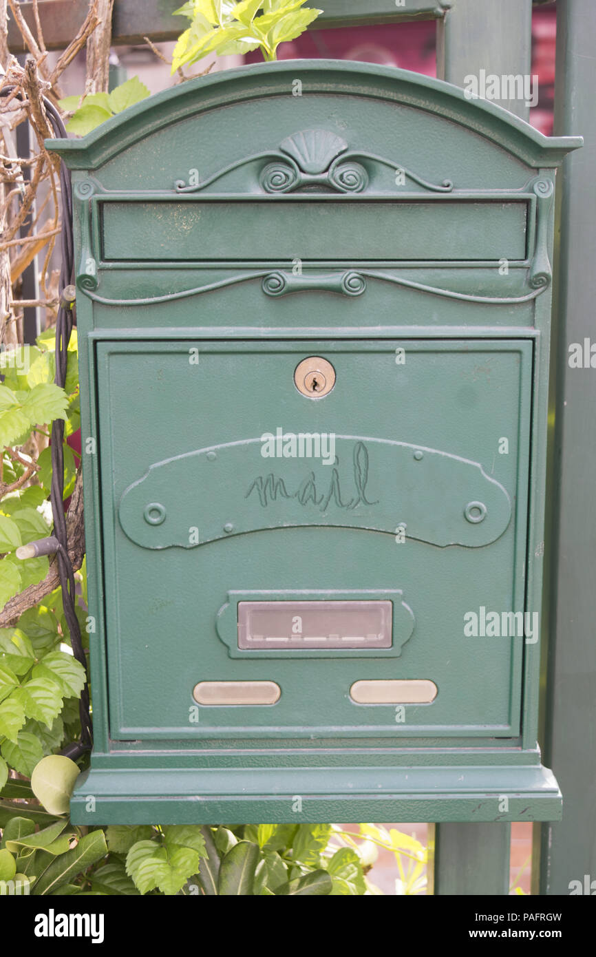 detail of a green mailbox of a house with garden Stock Photo - Alamy
