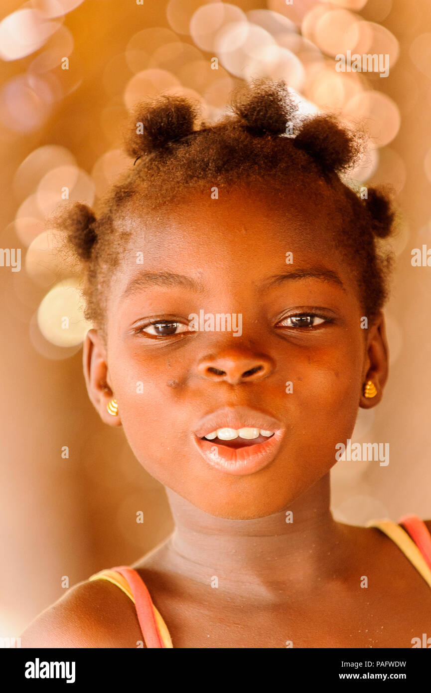 PORTO-NOVO, BENIN - MAR 10, 2012: Unidentified Beninese cute local girl ...
