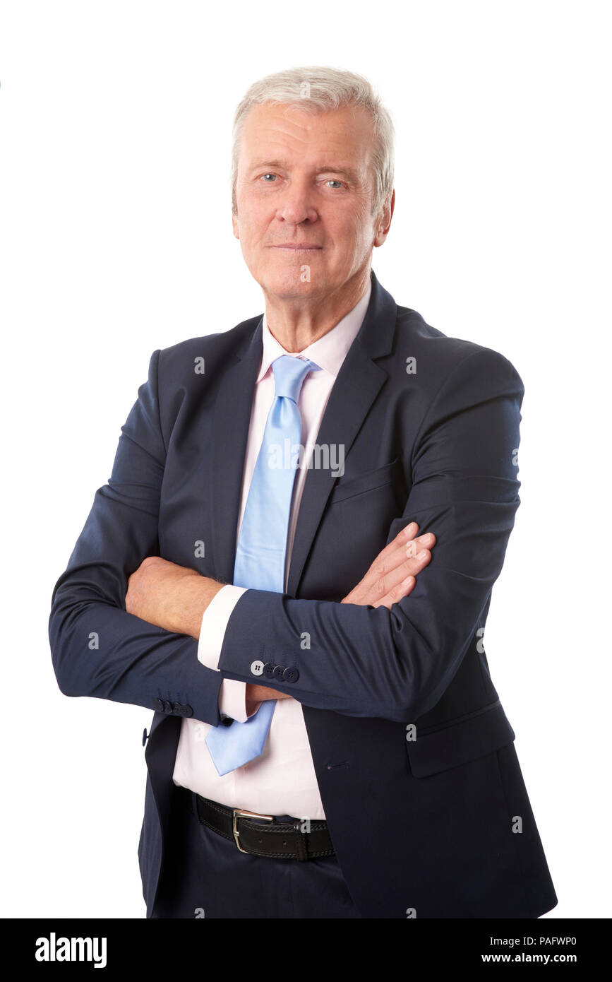 Portrait of a senor businessman standing with arms crossed at isolated ...