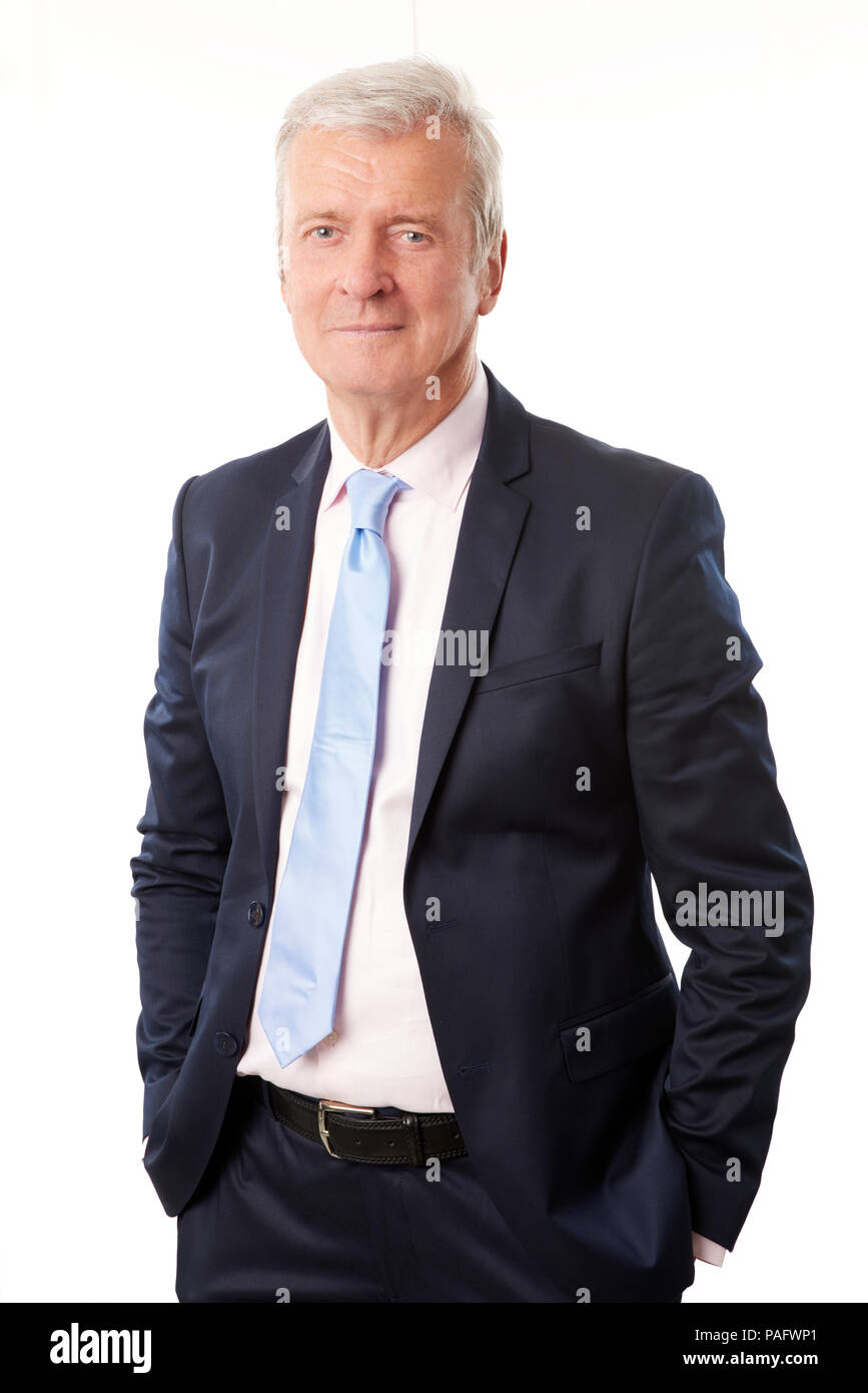 Portrait of a senor businessman standing at isolated white background ...