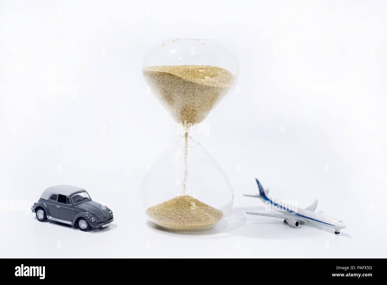 Abstract comparison of travel. Plane and car model isolated on white ...