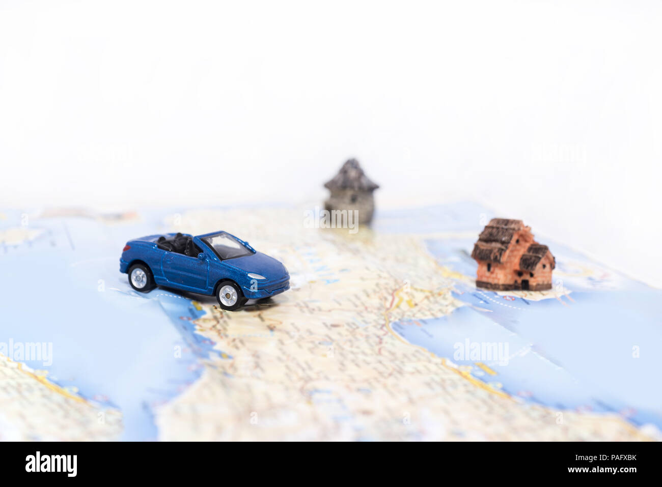 Abstract idea of rent a car. Small car on map. Abstract travel photo ...