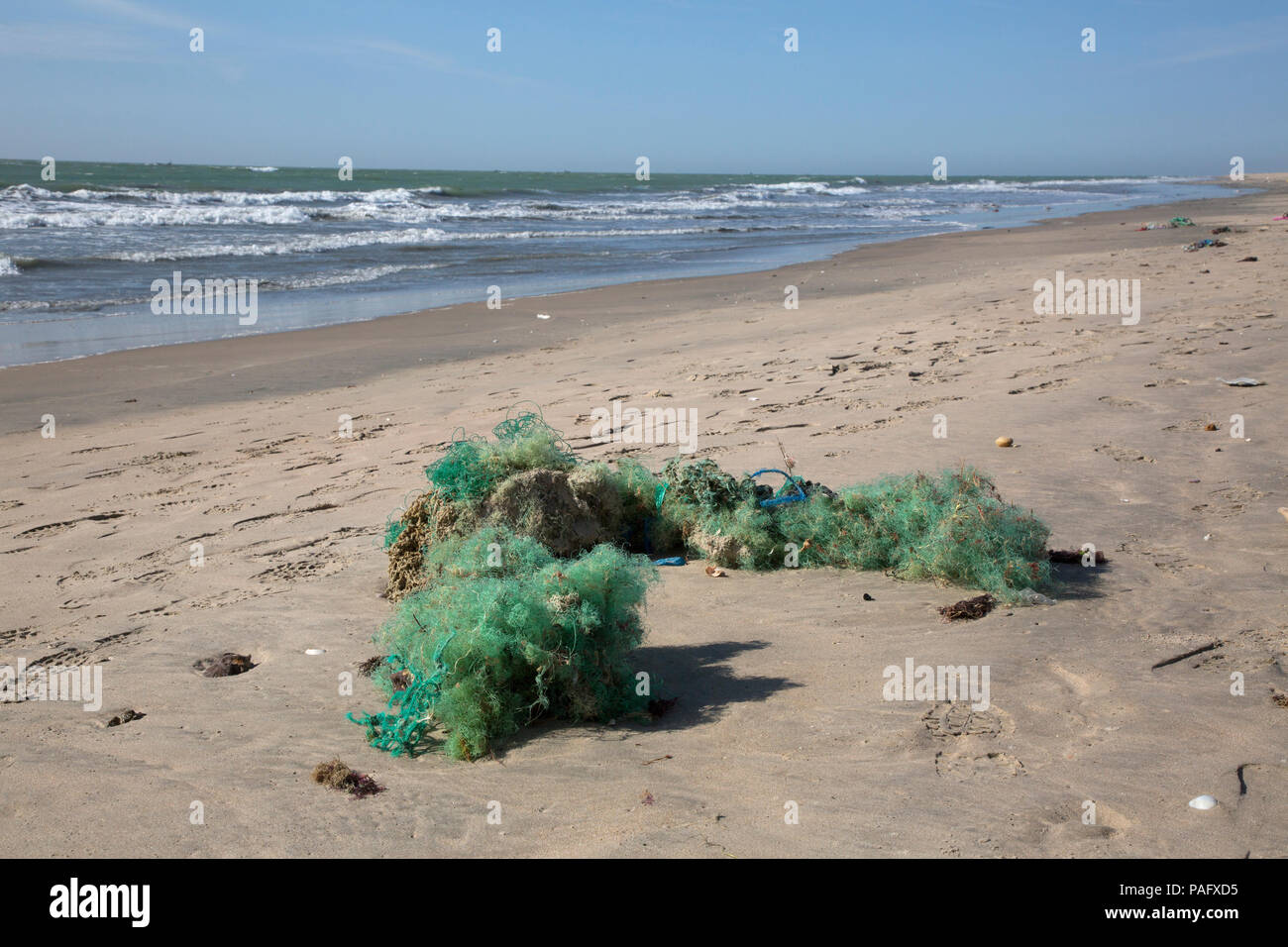 Discarded plastic fishing nets washed-up on beach, Tanji, The Gambia ...