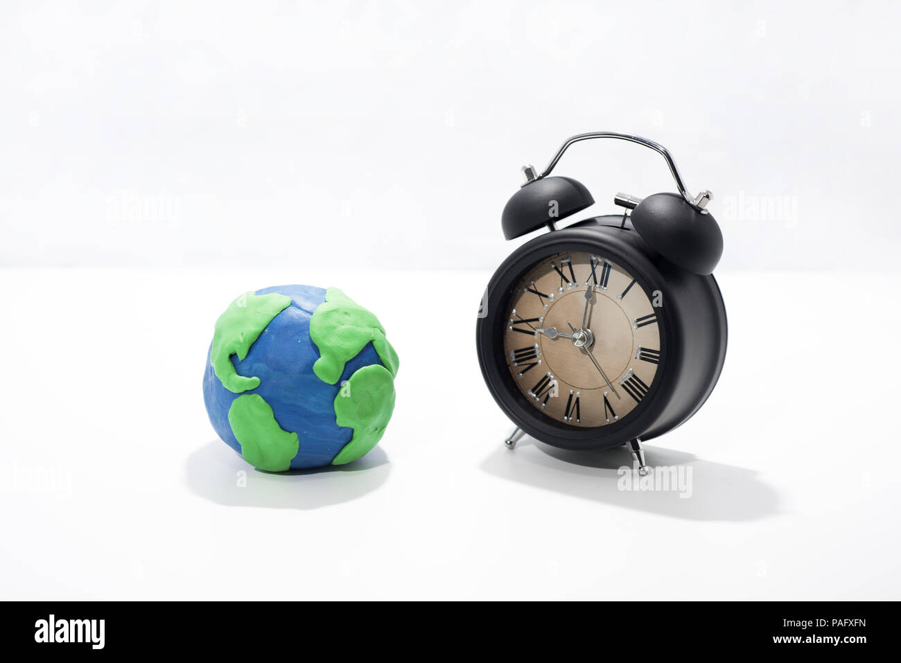 Small Earth model with human hands. Abstract composition of peace Stock ...