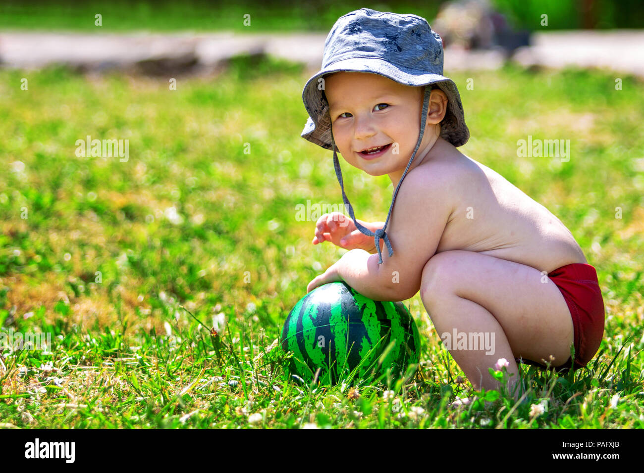 Portrait of a beautiful smiling little boy in the summer outdoors Stock ...