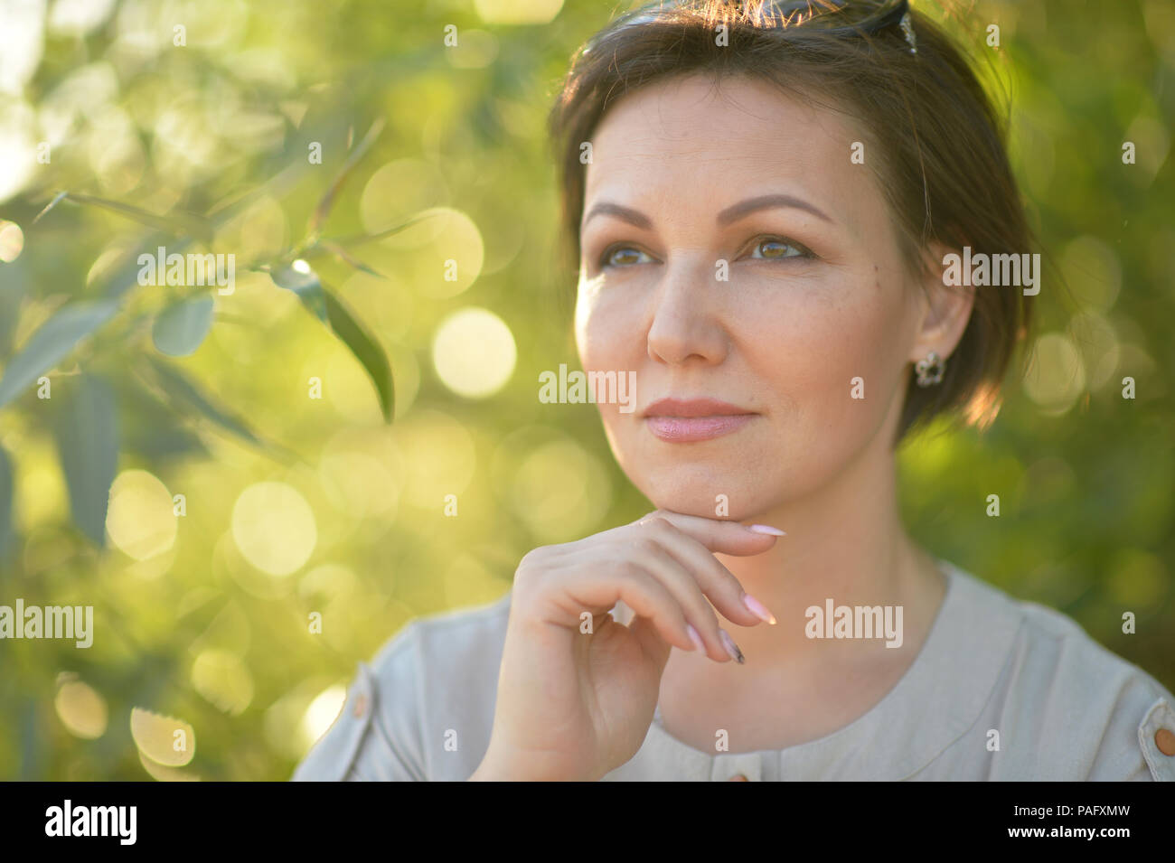 Beautiful young woman resting Stock Photo - Alamy