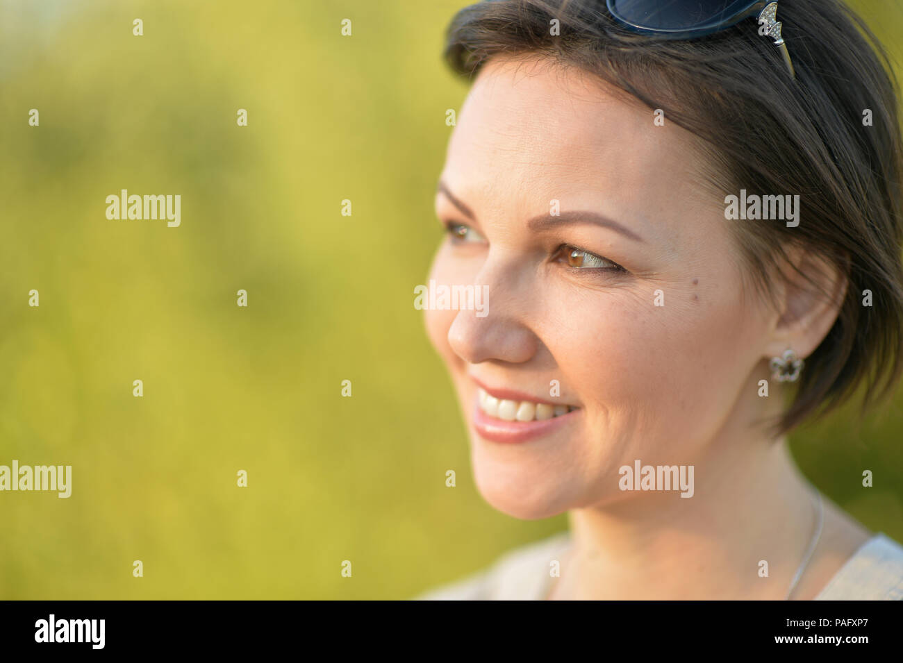 Beautiful young woman resting Stock Photo - Alamy