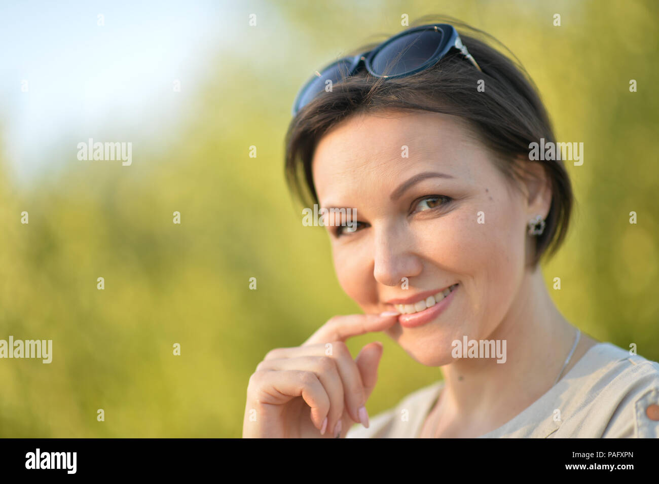 Beautiful young woman resting Stock Photo - Alamy