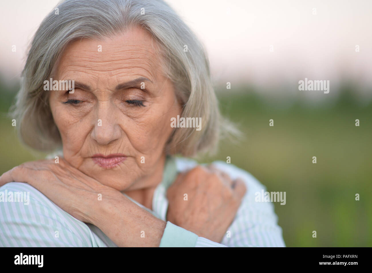 Portrait of sad senior woman Stock Photo - Alamy
