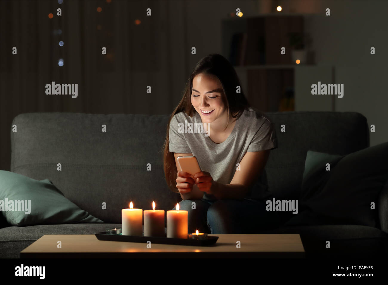 Holding candle in dark room hi-res stock photography and images - Alamy