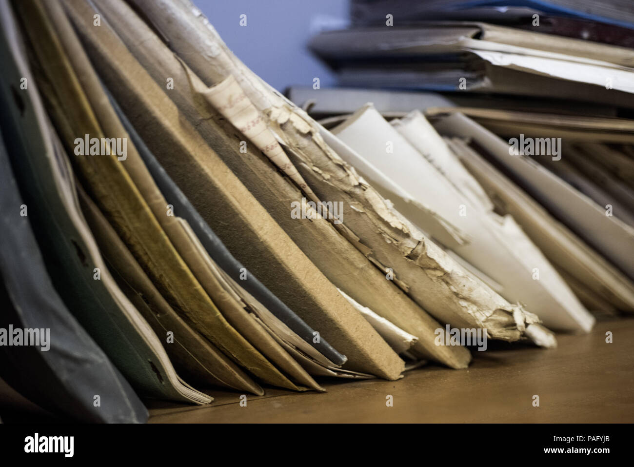 Old documents on table. Isolated on white background Stock Photo - Alamy