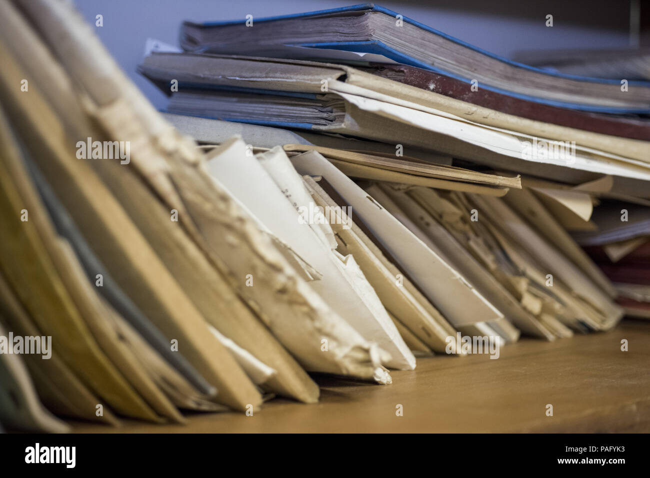 Old documents on table. Isolated on white background Stock Photo - Alamy