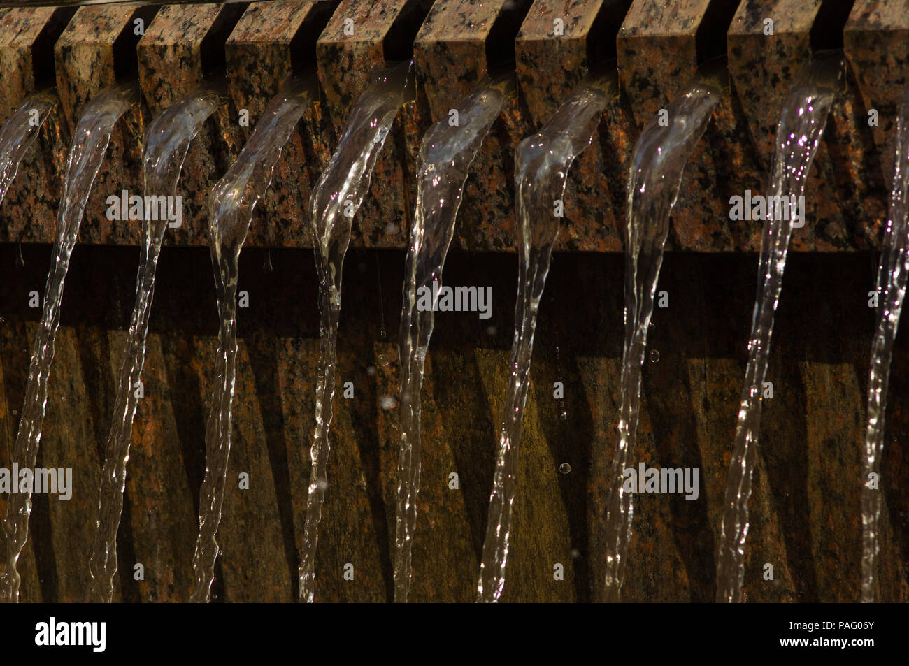 Fountain in city park on hot summer day, beautiful bright streams of ...