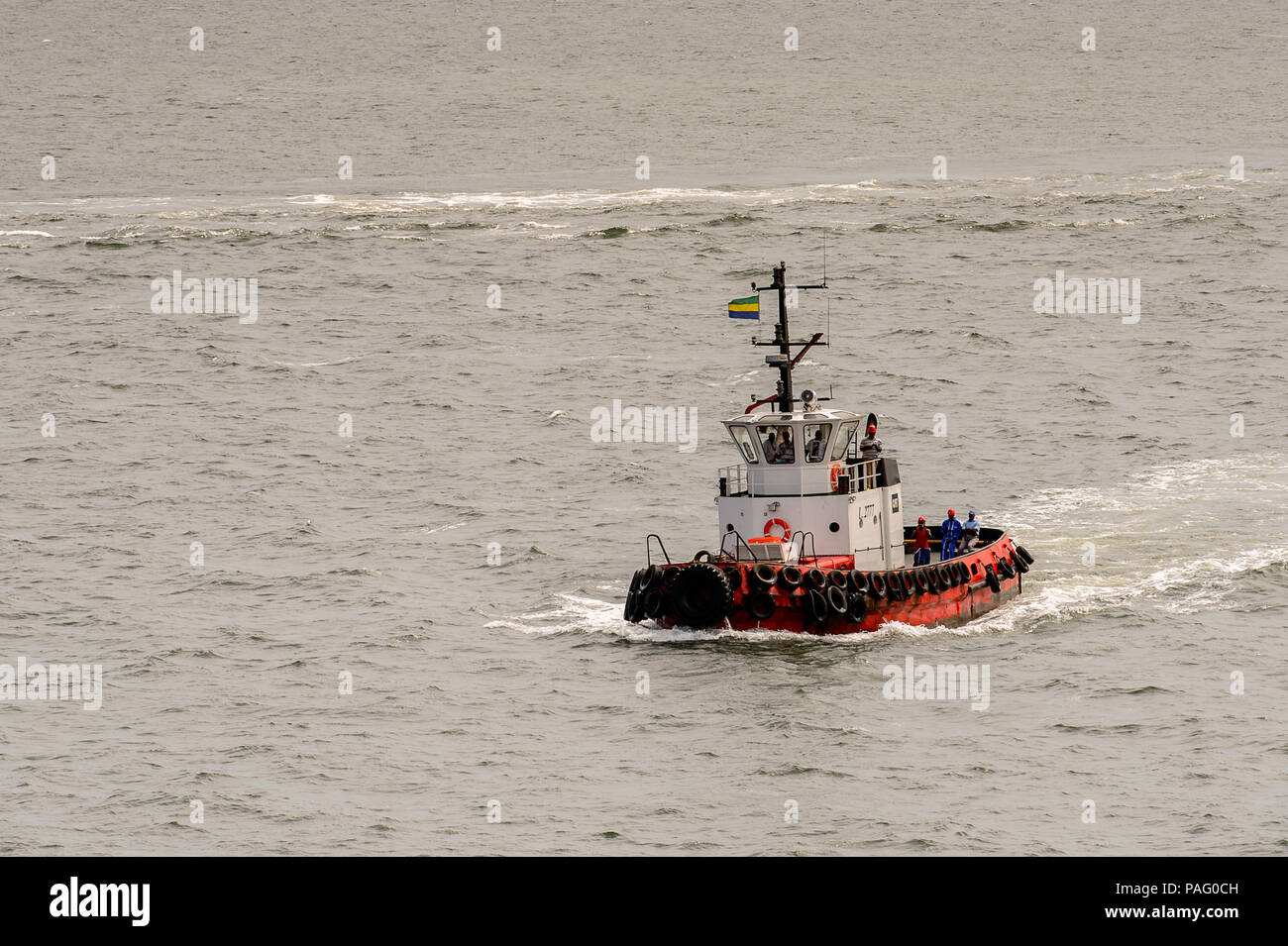 LIBREVILLE, GABON - MAR 6, 2013: Small boat sails near the port of ...