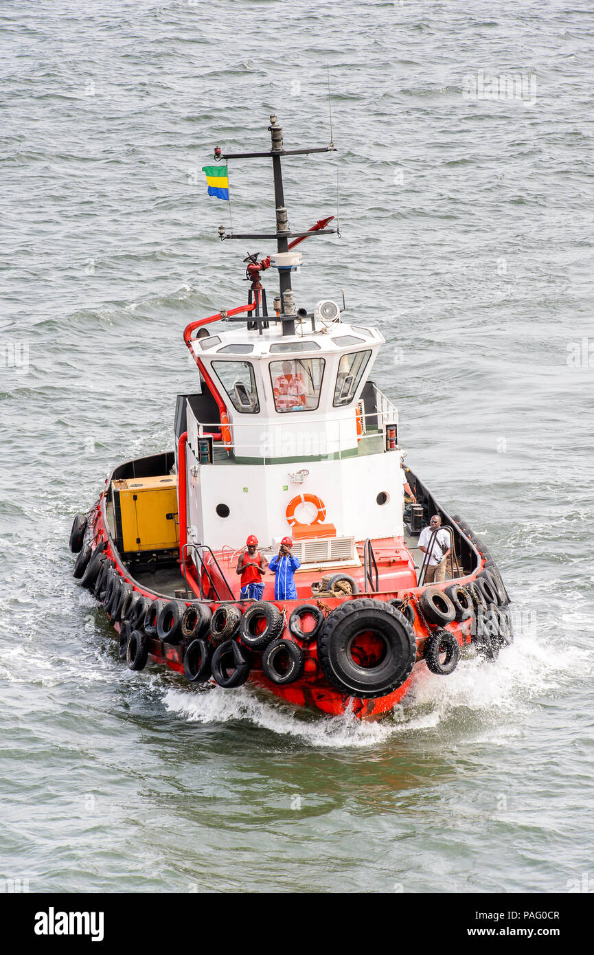 LIBREVILLE, GABON - MAR 6, 2013: Small boat sails near the port of ...