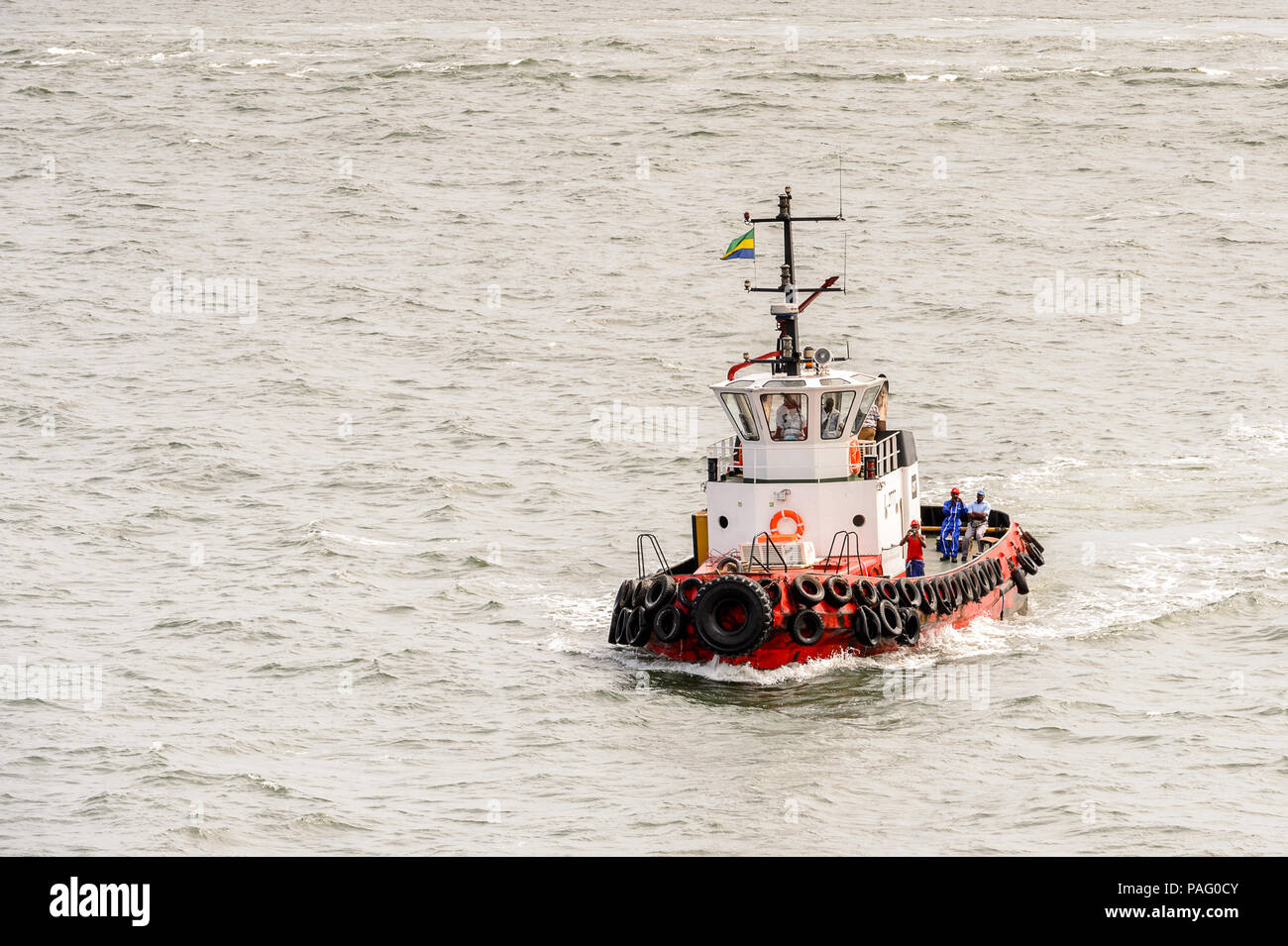 LIBREVILLE, GABON - MAR 6, 2013: Small boat sails near the port of ...