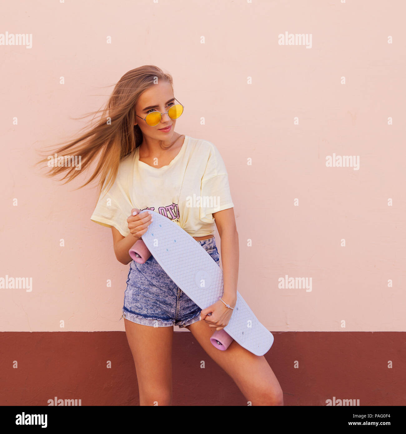 Portrait of beauty fashion smiling young women with yellow sunglasses ...