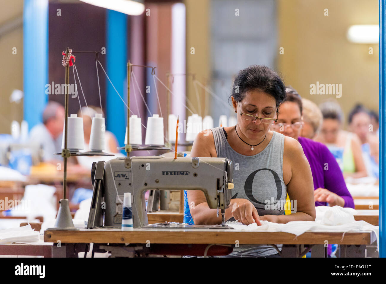 CUBA, HAVANA - MAY 5, 2017: Workers at the garment factory. Copy space ...